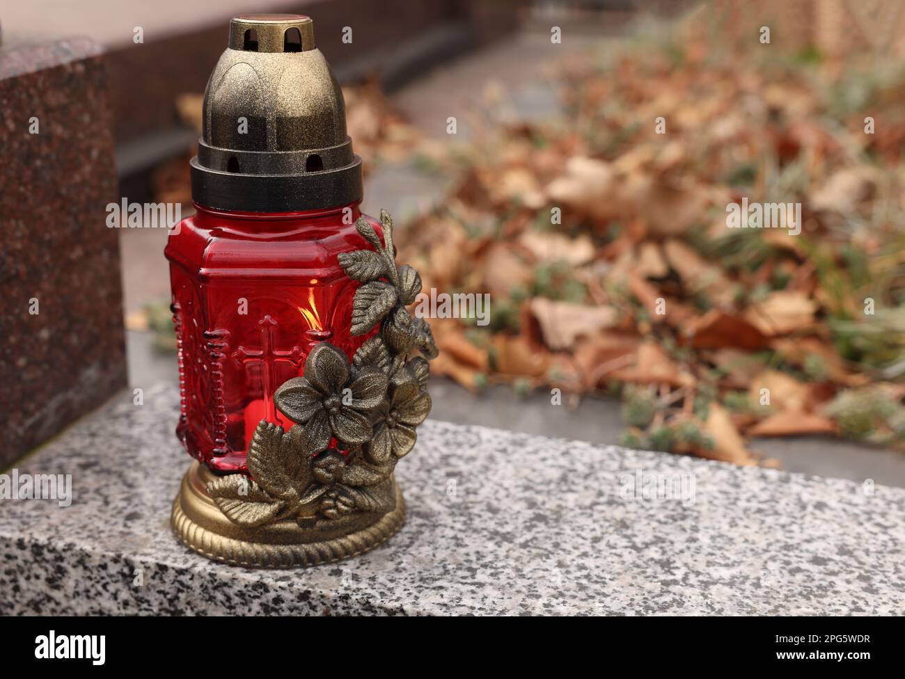 Grave lantern on granite surface at cemetery, space for text Stock Photo - Alamy
