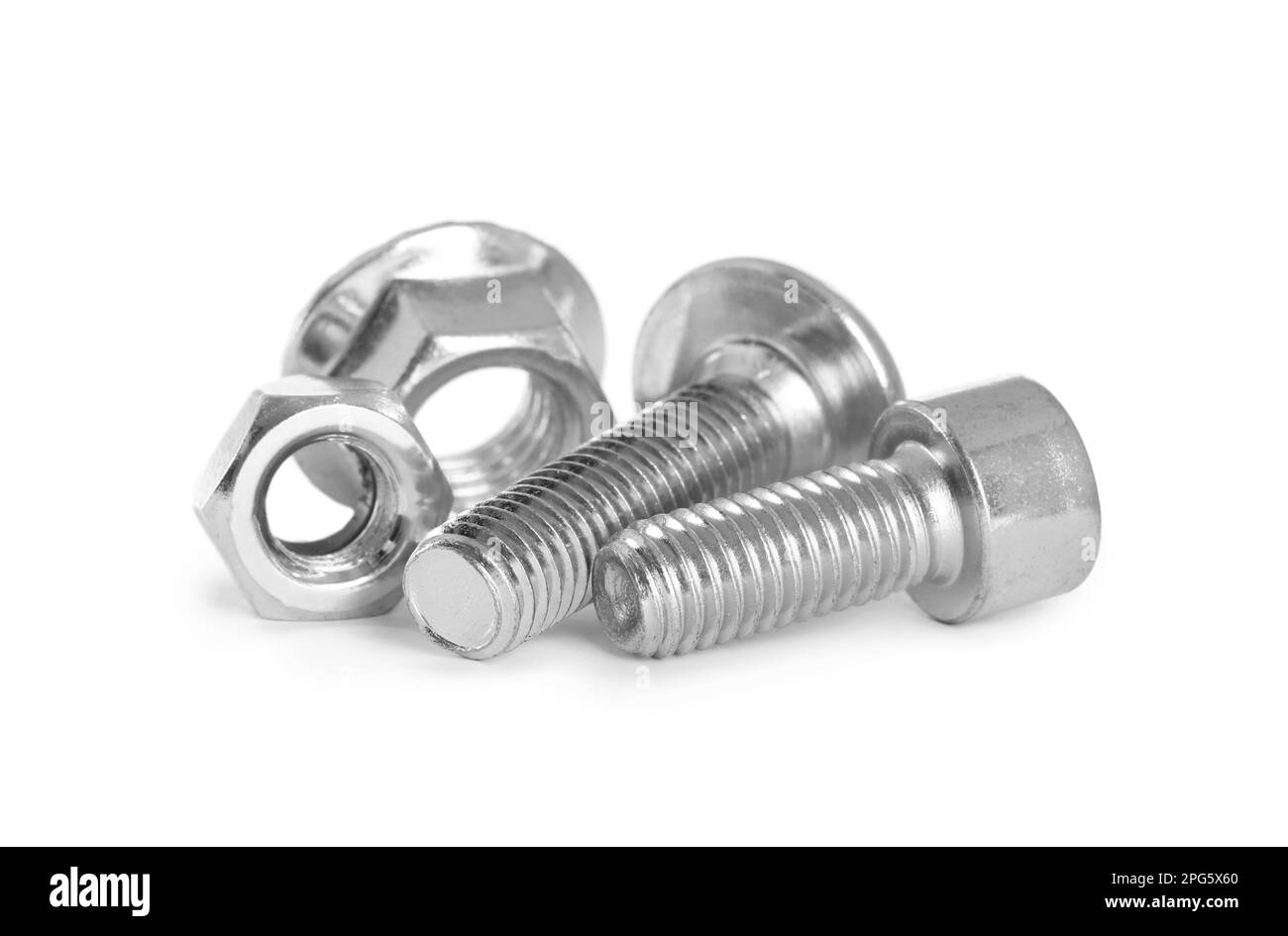 Different metal bolts and nuts on white background Stock Photo - Alamy
