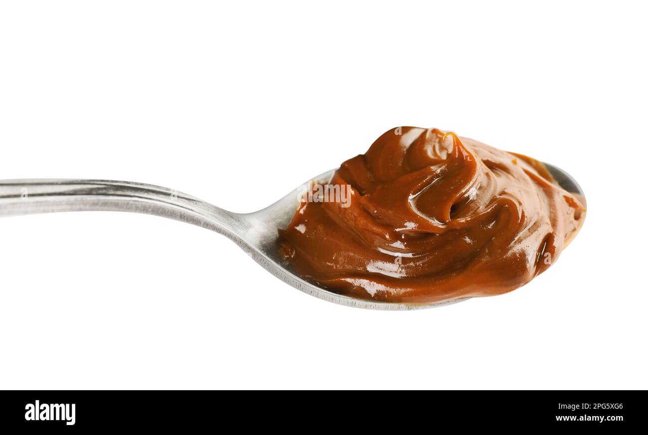 Spoon with tasty boiled condensed milk isolated on white Stock Photo ...