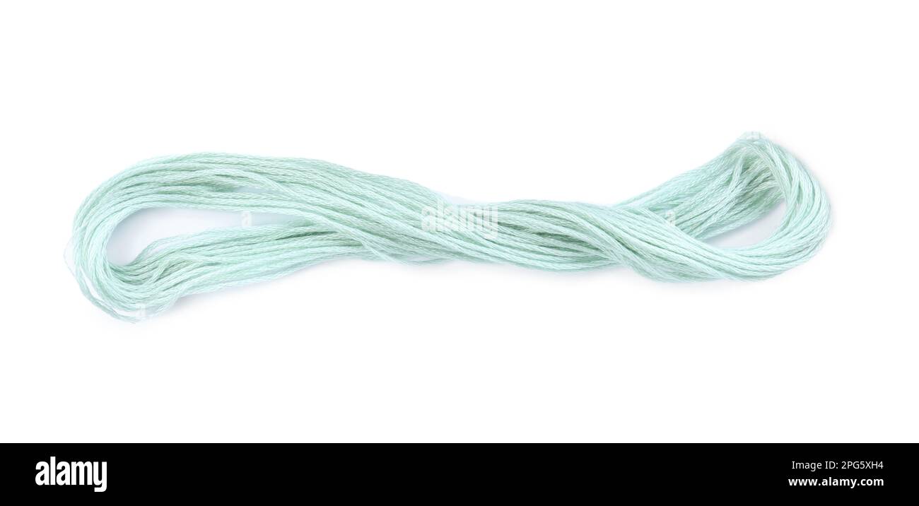 Light pastel blue embroidery thread on white background Stock Photo - Alamy