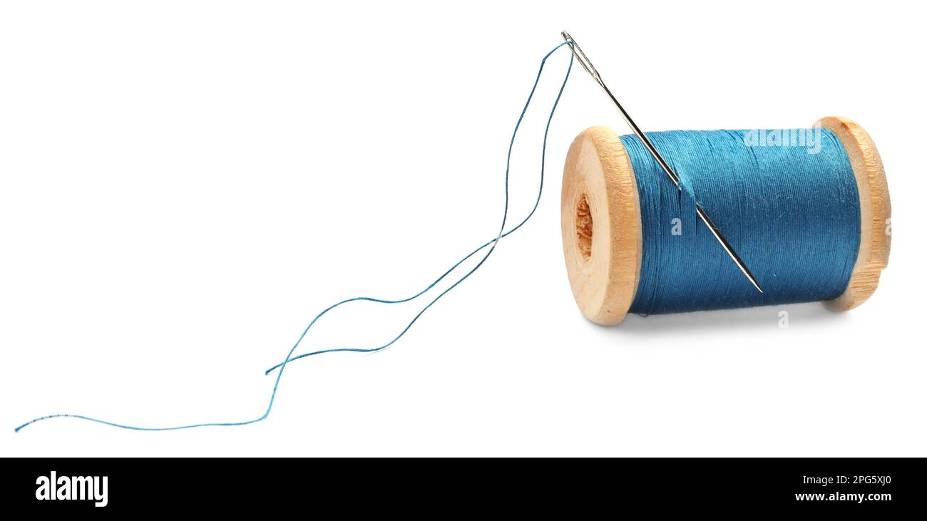 Light blue sewing thread with needle on white background Stock Photo ...