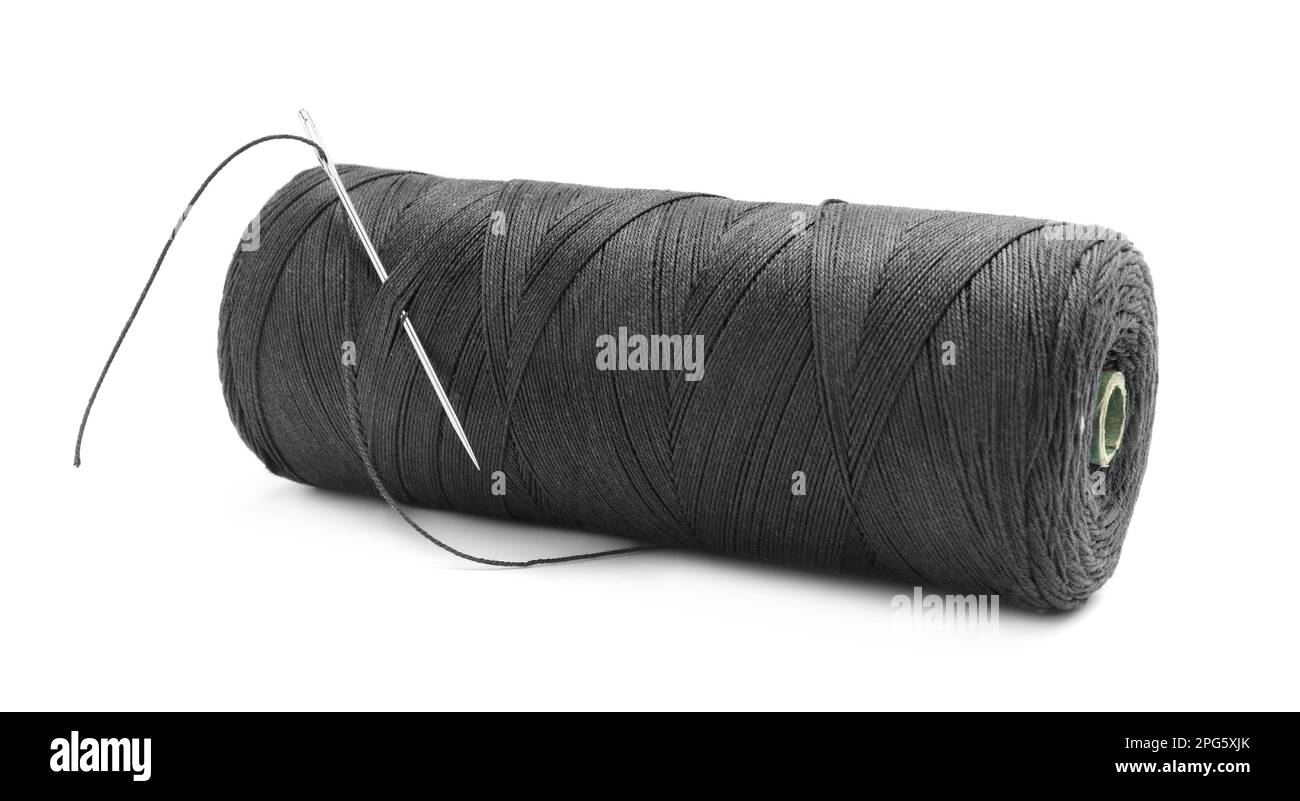 Black sewing thread with needle on white background Stock Photo - Alamy