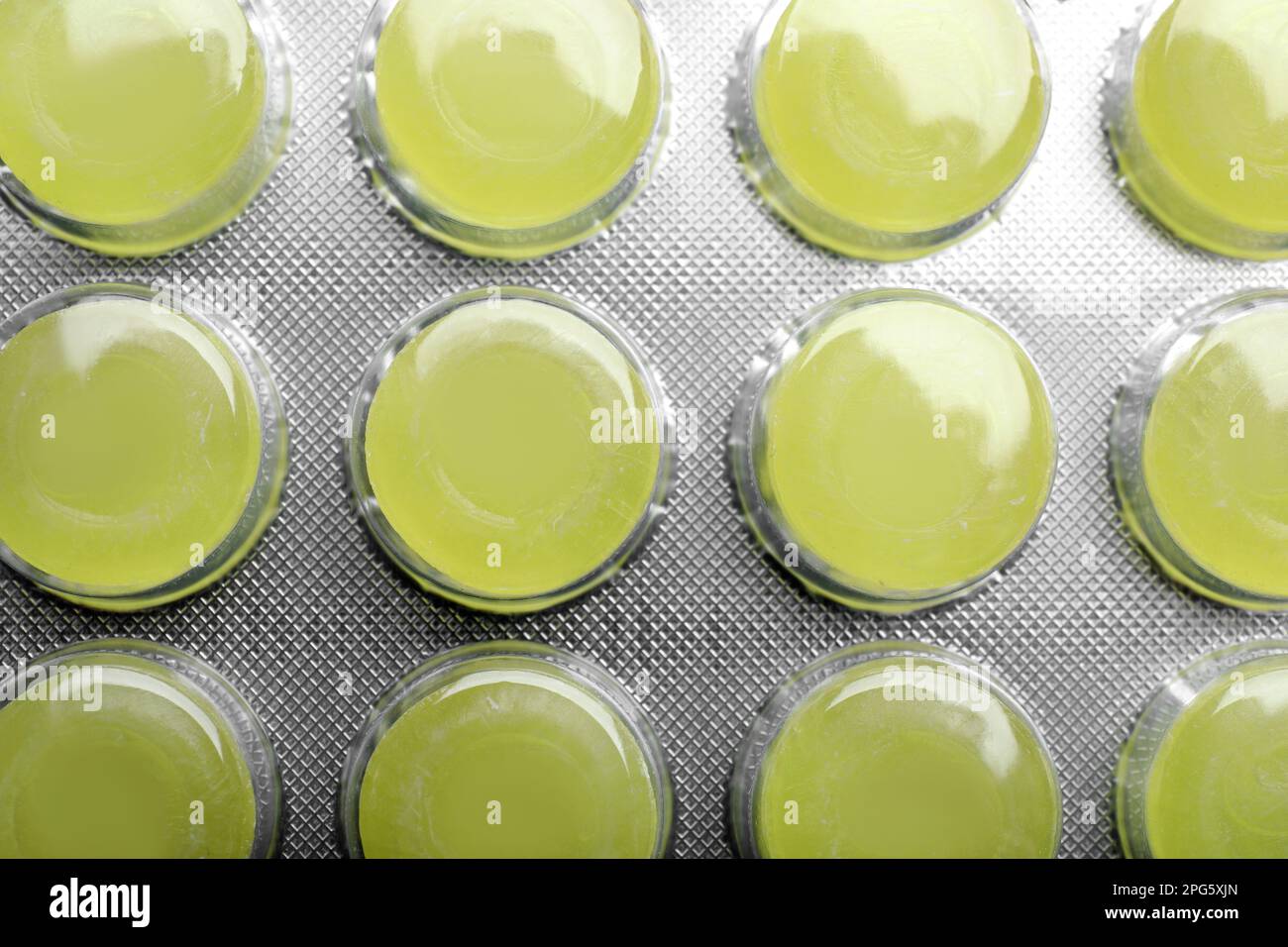 Blister with yellow cough drops as background, closeup Stock Photo - Alamy