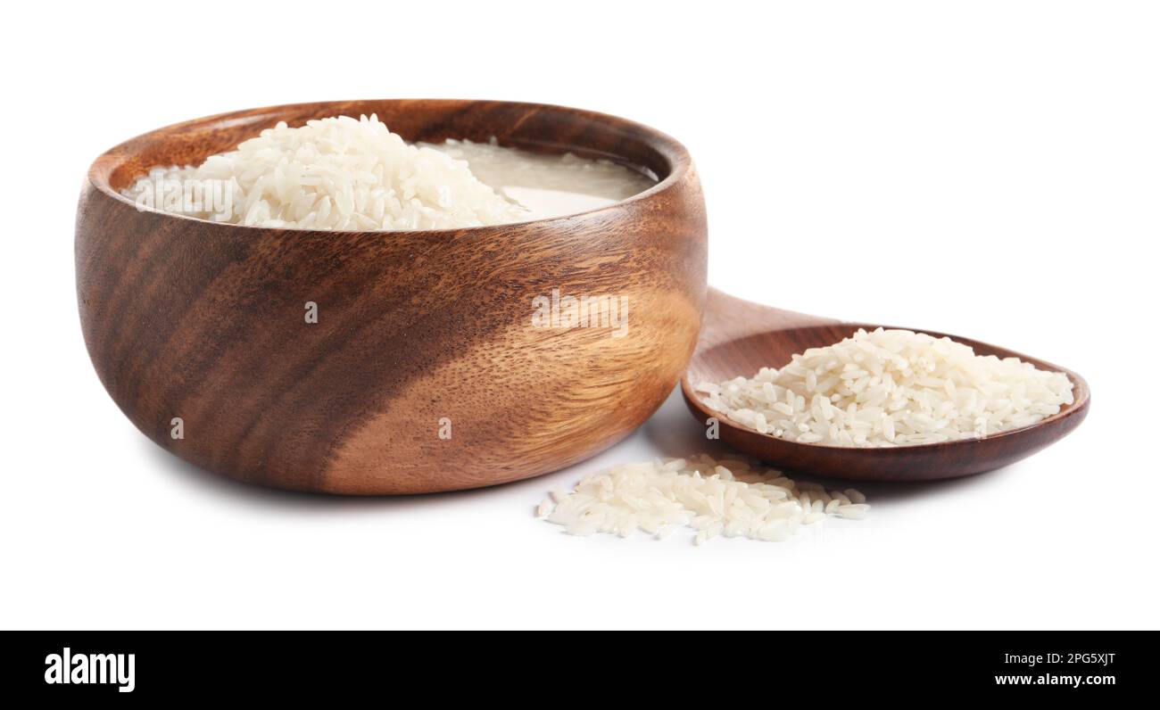 Rice soaked in water on white background Stock Photo - Alamy