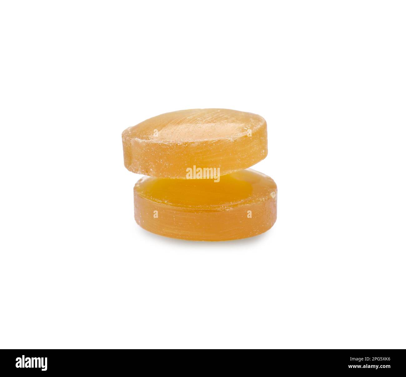 Two yellow cough drops on white background Stock Photo - Alamy