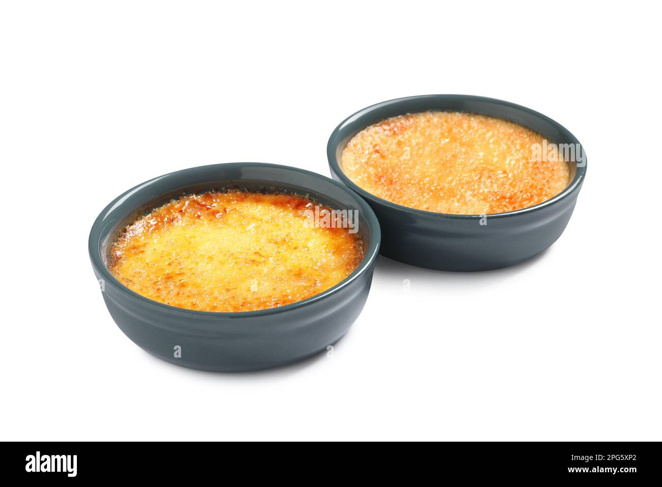 Delicious creme brulee in ceramic ramekins on white background Stock ...