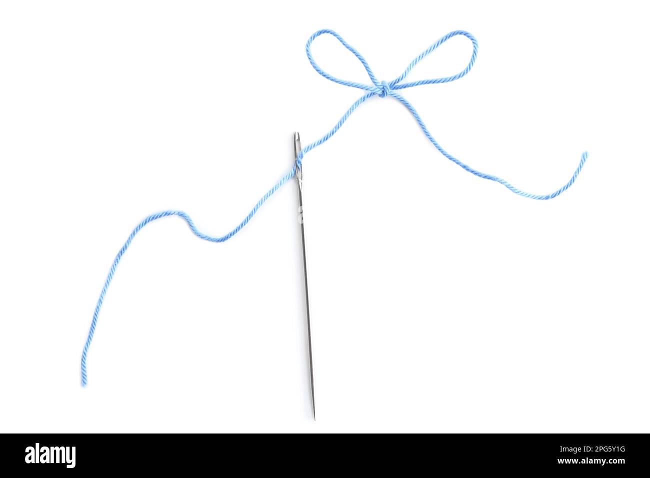 Needle with light blue sewing thread on white background, top view ...