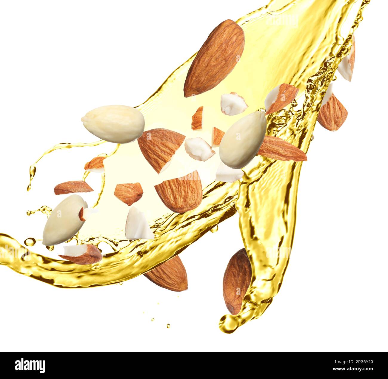 Organic almond oil and tasty nuts flying on white background Stock ...