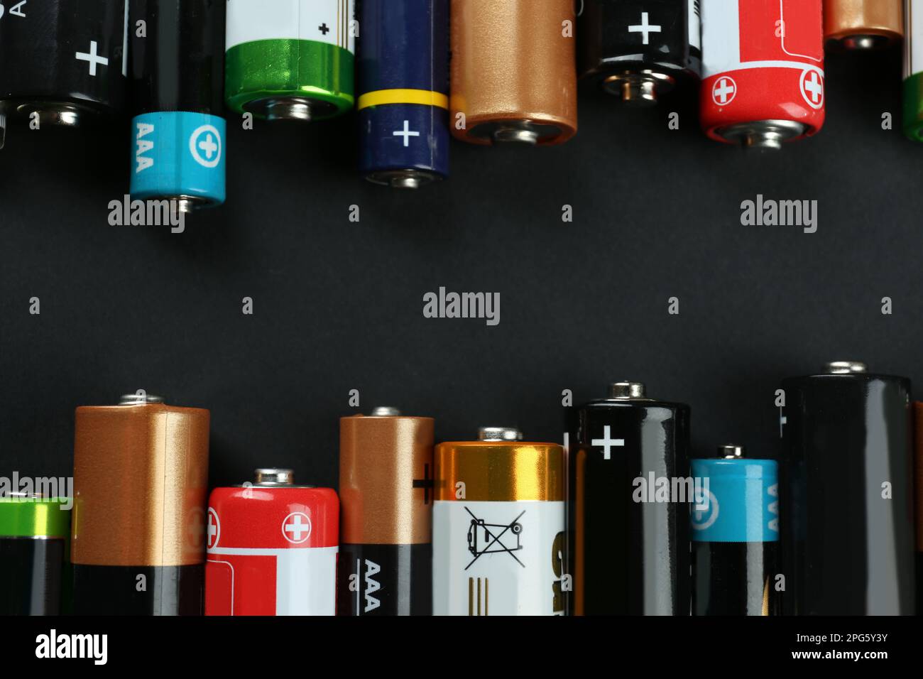 Many different batteries on black background, flat lay Stock Photo - Alamy