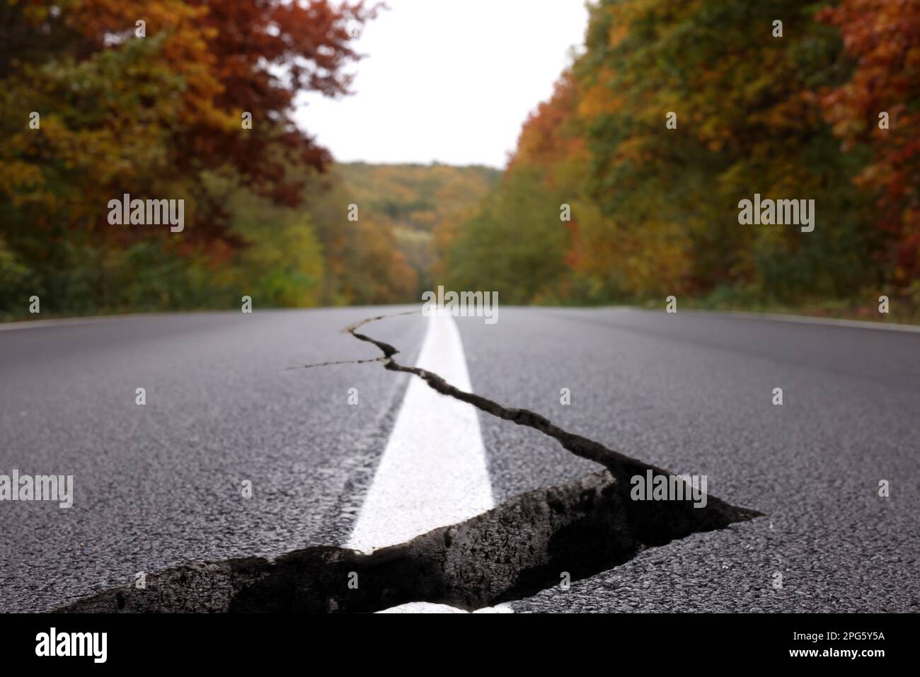 Large crack on asphalt road after earthquake Stock Photo - Alamy
