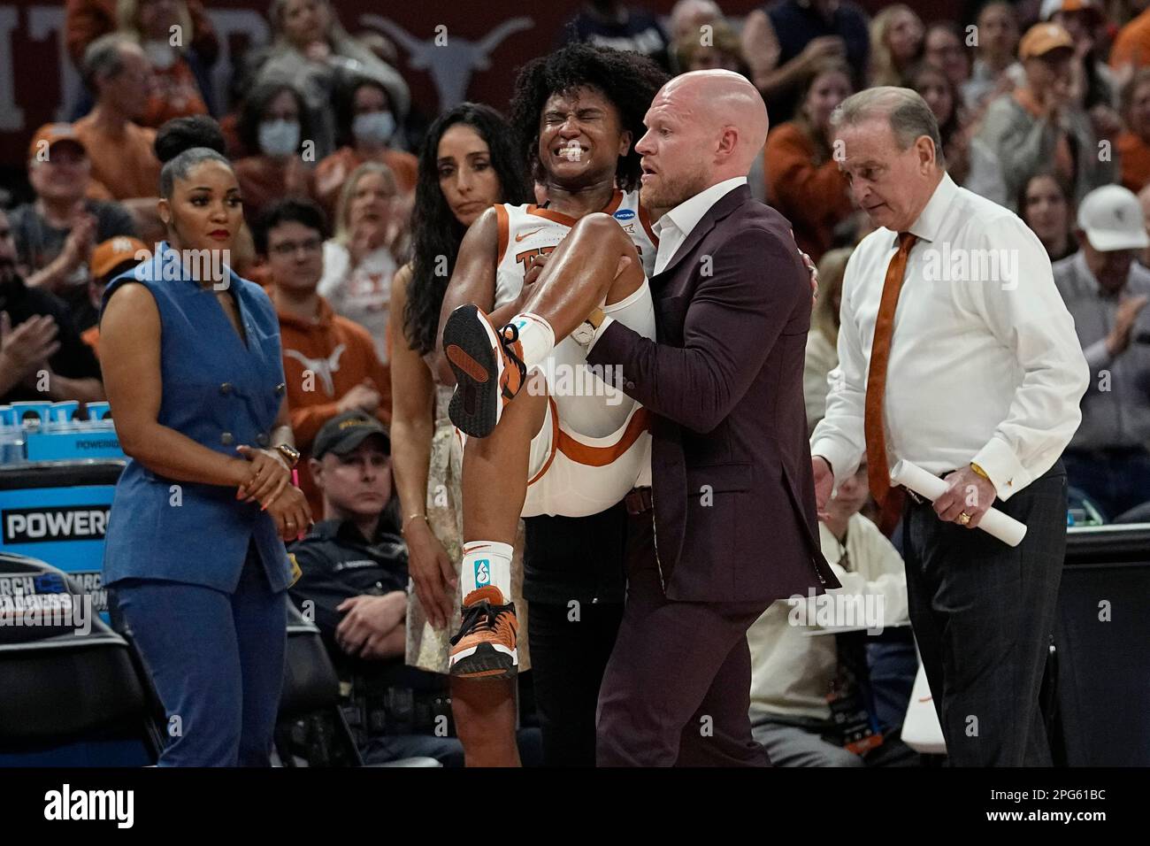 Texas guard Rori Harmon, center, is carried off the court after she was ...