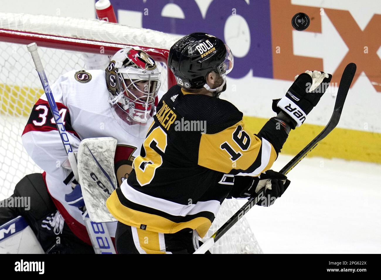 Pittsburgh Penguins' Jason Zucker (16) reaches for an airborne puck in ...