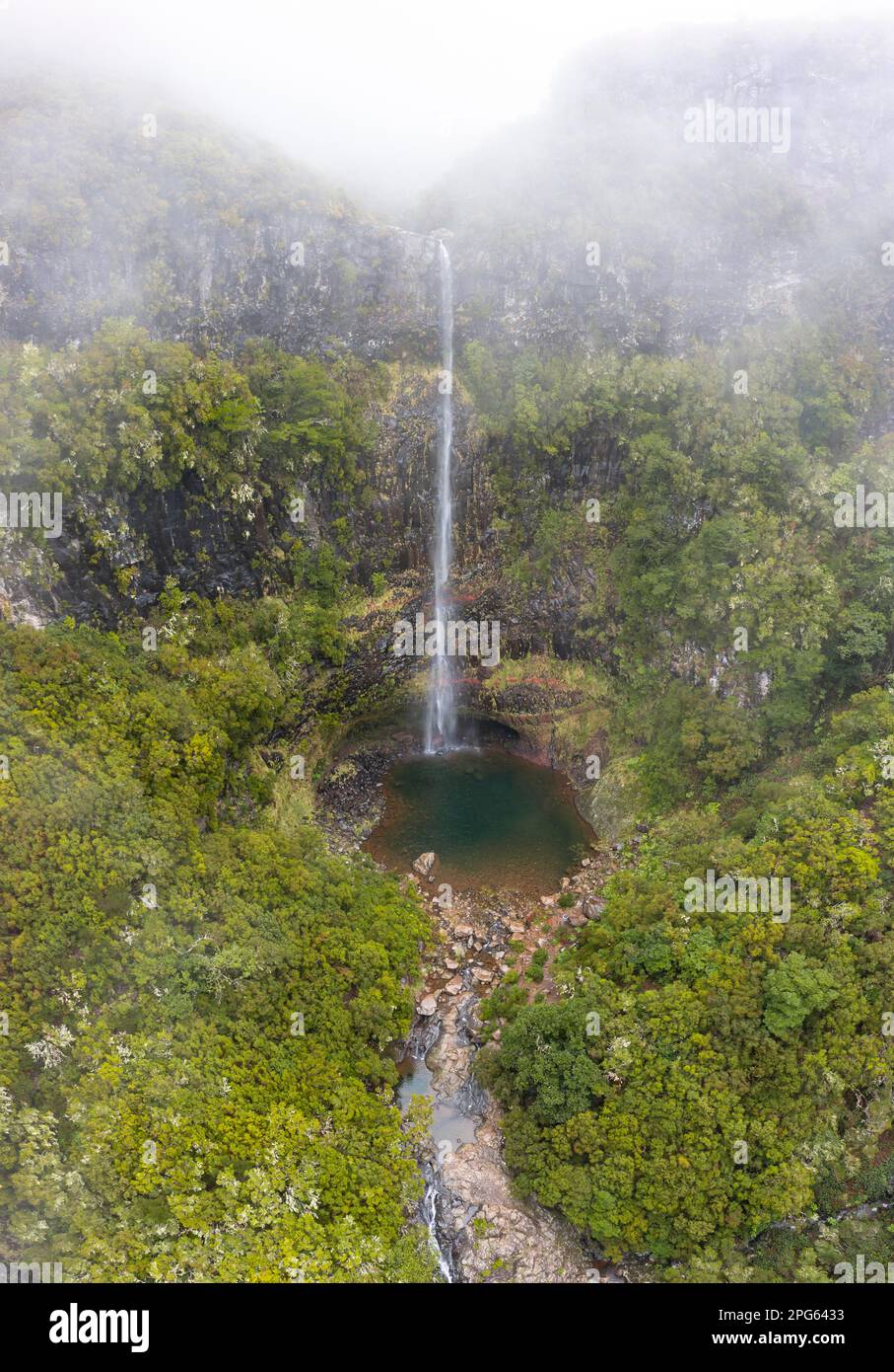 Aerial view, Lagoa do Vento with Upper Risco waterfall, forest and fog ...