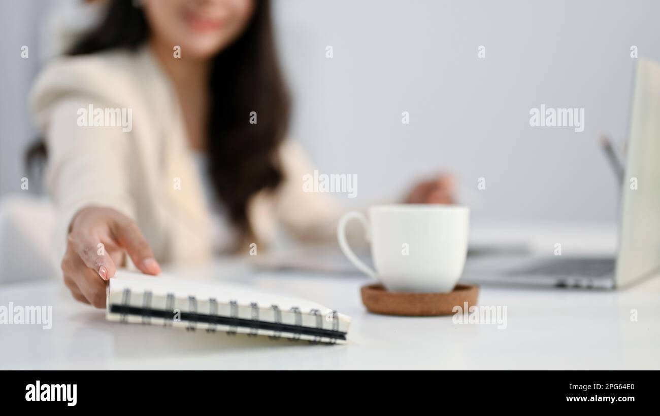 Close-up image of a businesswoman or female office worker grabbing a ...
