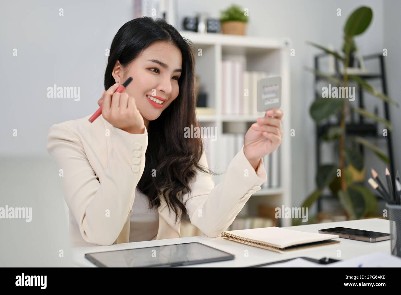 Charming and beautiful millennial Asian female office worker applying ...