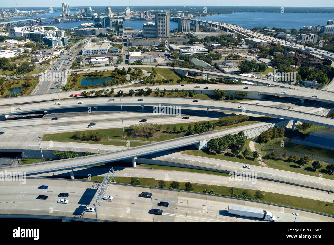 Aerial view of freeway overpass junction with fast moving traffic cars ...