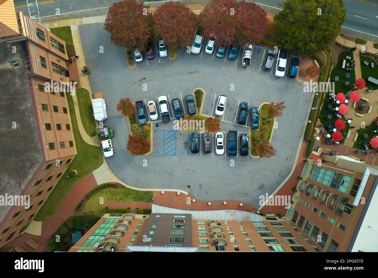 Aerial view of many colorful cars parked on parking lot on apartment ...