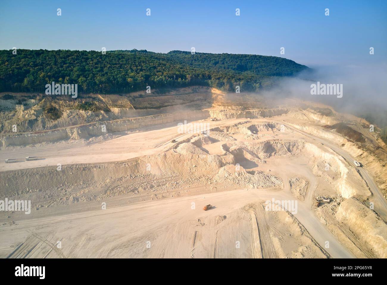 Aerial view of open pit mining of limestone materials for construction ...