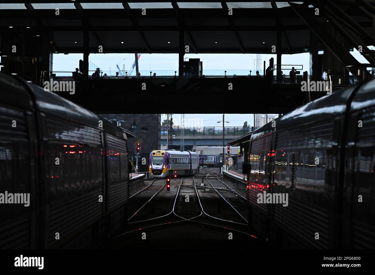 A V/Line train is seen arriving to a platform at Southern Cross Station ...
