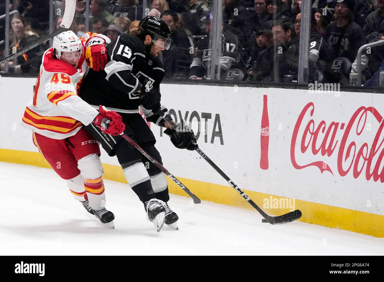 Los Angeles Kings left wing Alex Iafallo, right, works against Calgary ...