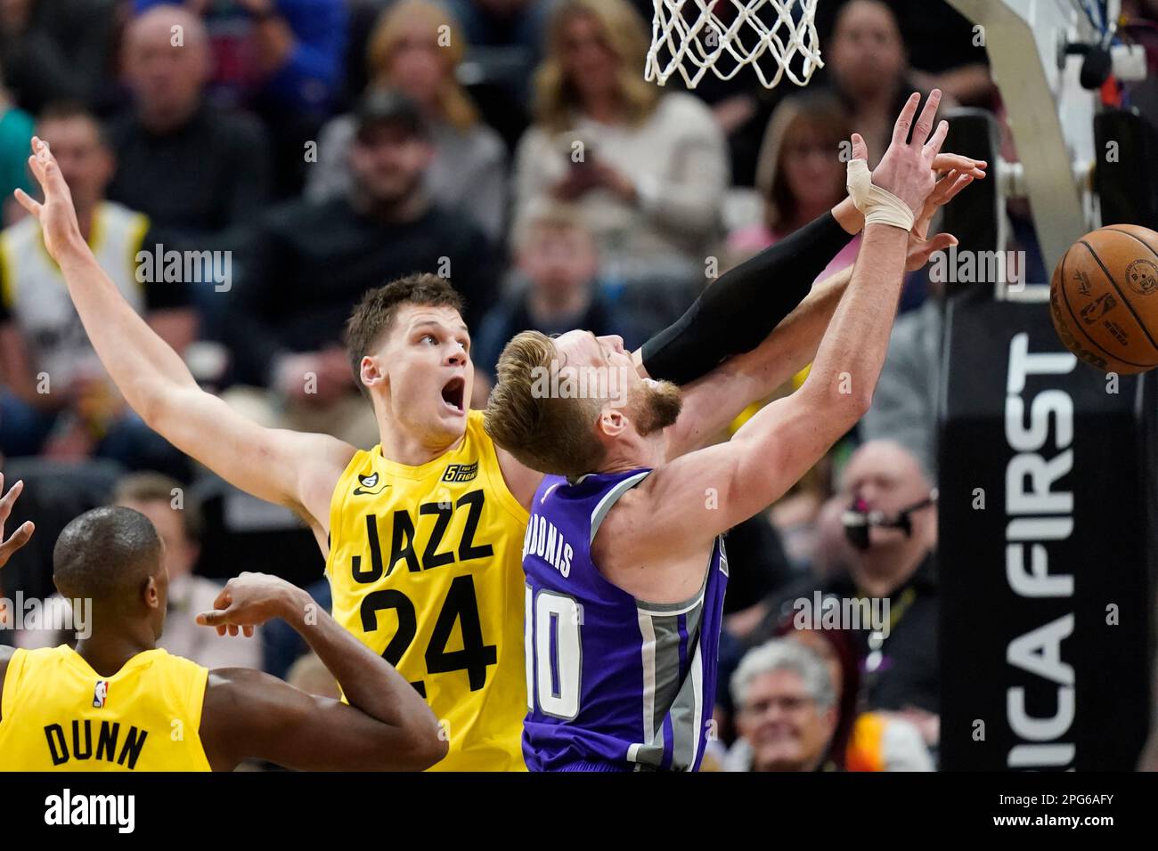 Utah Jazz center Walker Kessler (24) blocks Sacramento Kings forward Domantas Sabonis (10) in ...