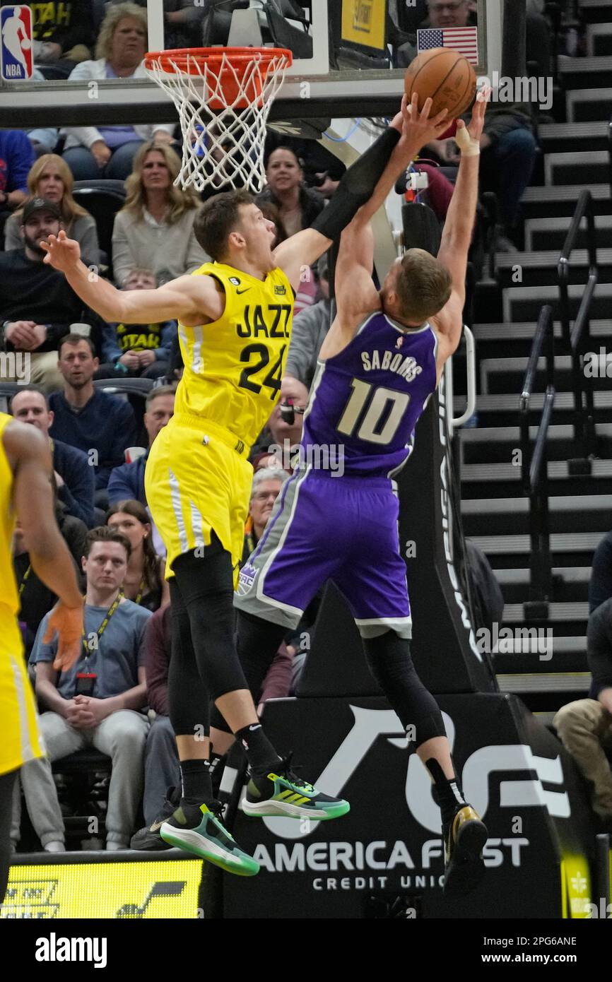 Utah Jazz center Walker Kessler (24) blocks Sacramento Kings forward Domantas Sabonis (10) in ...