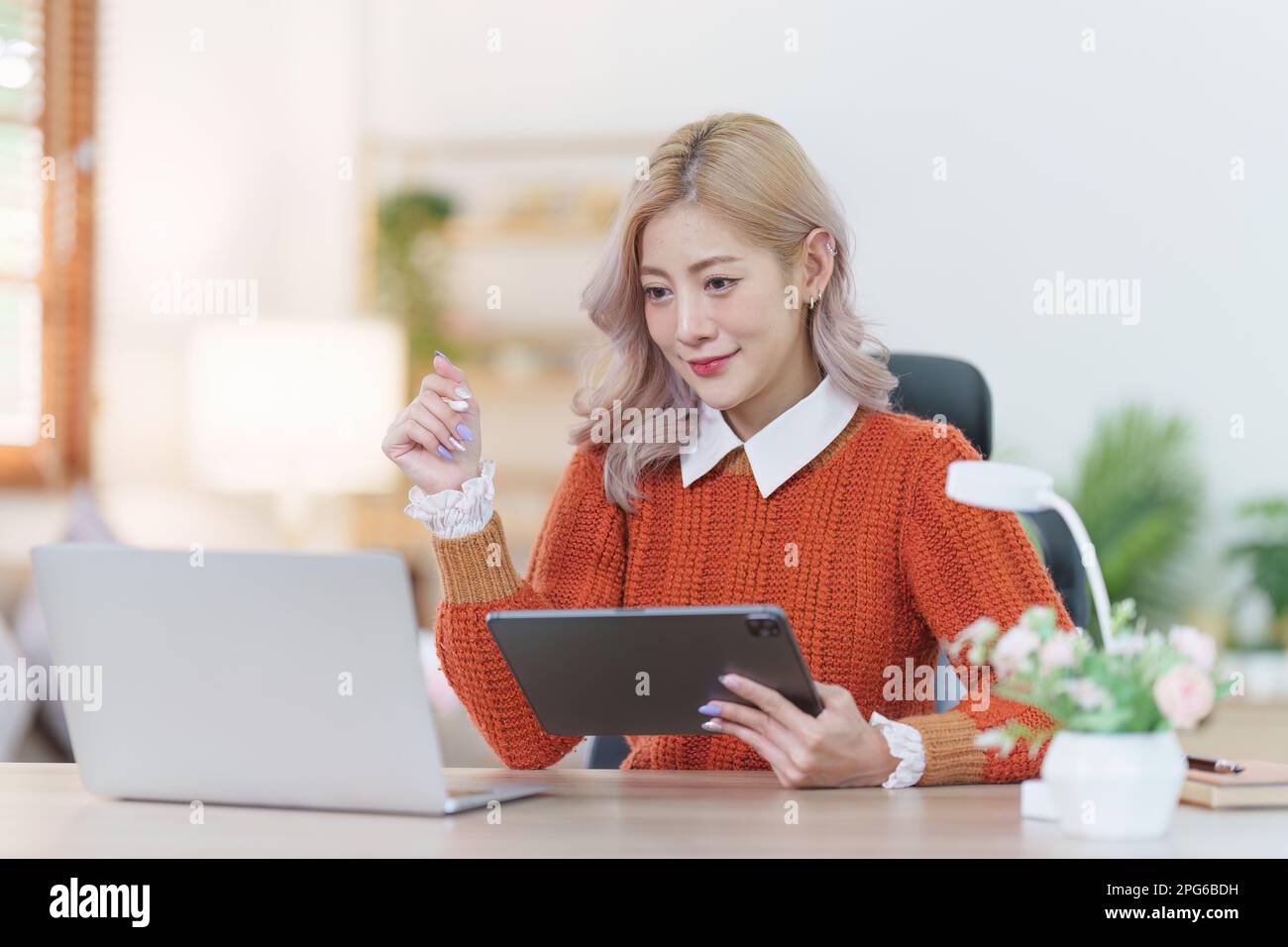 Beautiful Business woman analysis and research with financial graph at ...