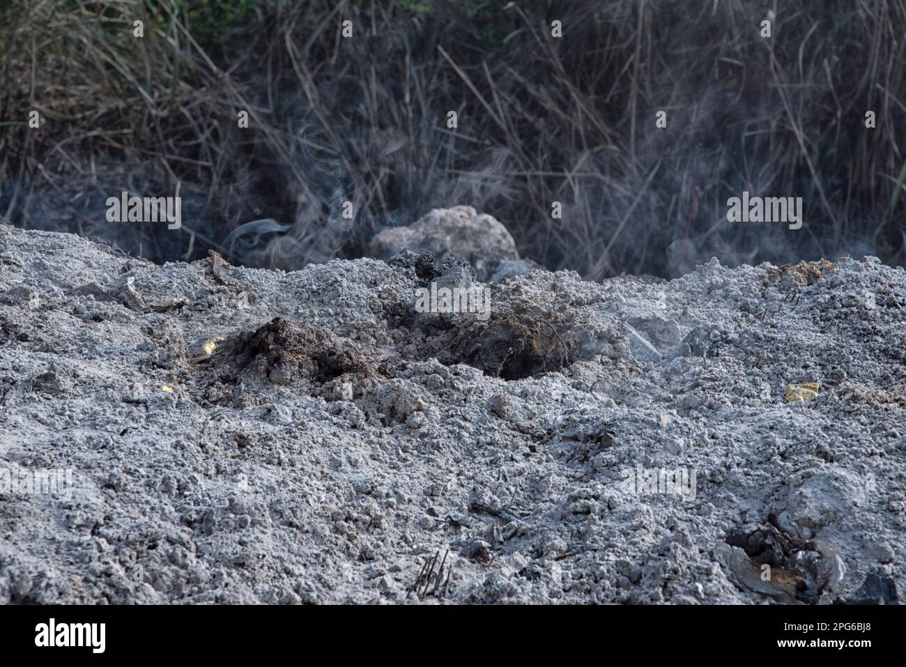 pile of ashes on the dumpster ground Stock Photo - Alamy