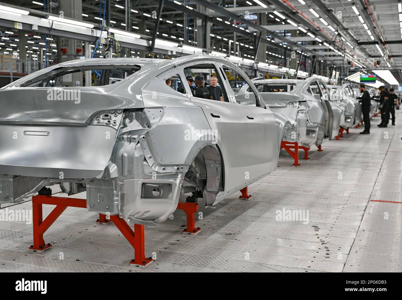 20 March 2023, Brandenburg, Grünheide: Car bodies of the Model Y ...