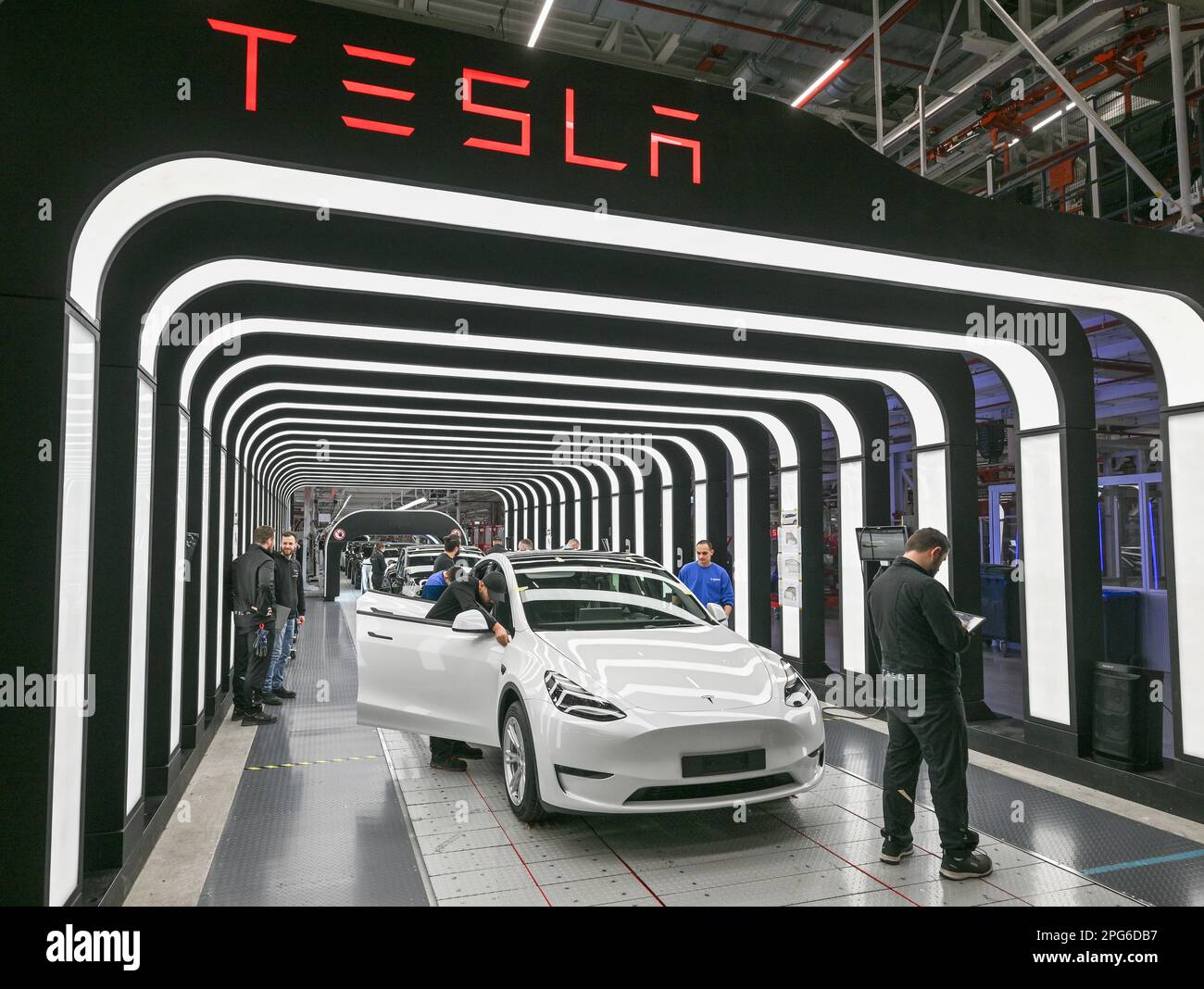 20 March 2023, Brandenburg, Grünheide: Employees of the Tesla ...