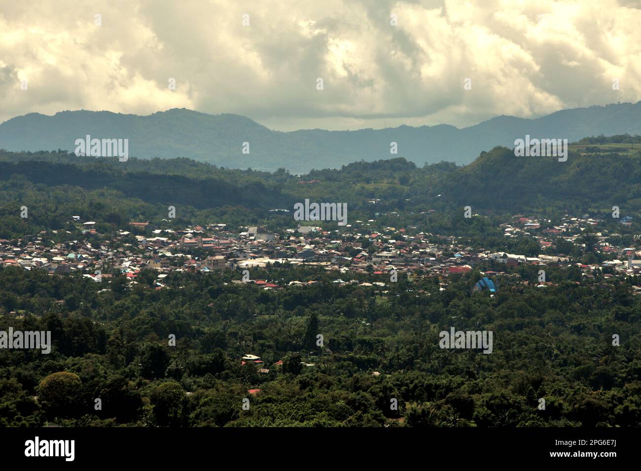 Landscape of Tomohon City in a background of an ancient caldera rim ...