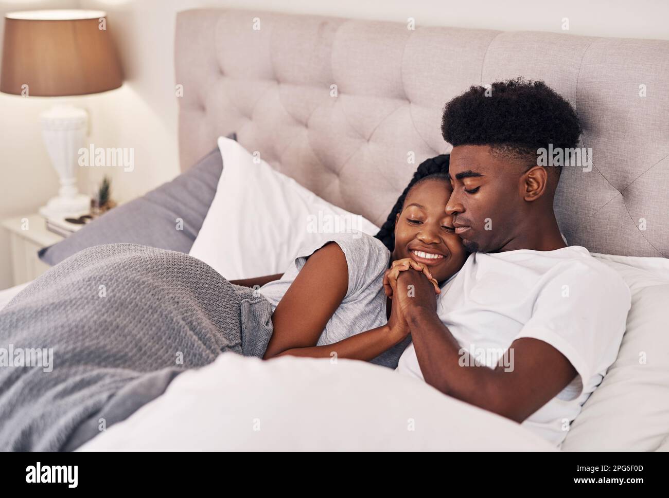 Say youll stay with me forever. a young couple lying in bed together ...