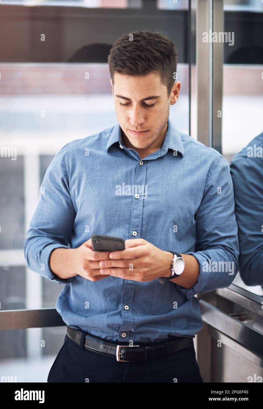 Adult person on elevator texting hi-res stock photography and images ...