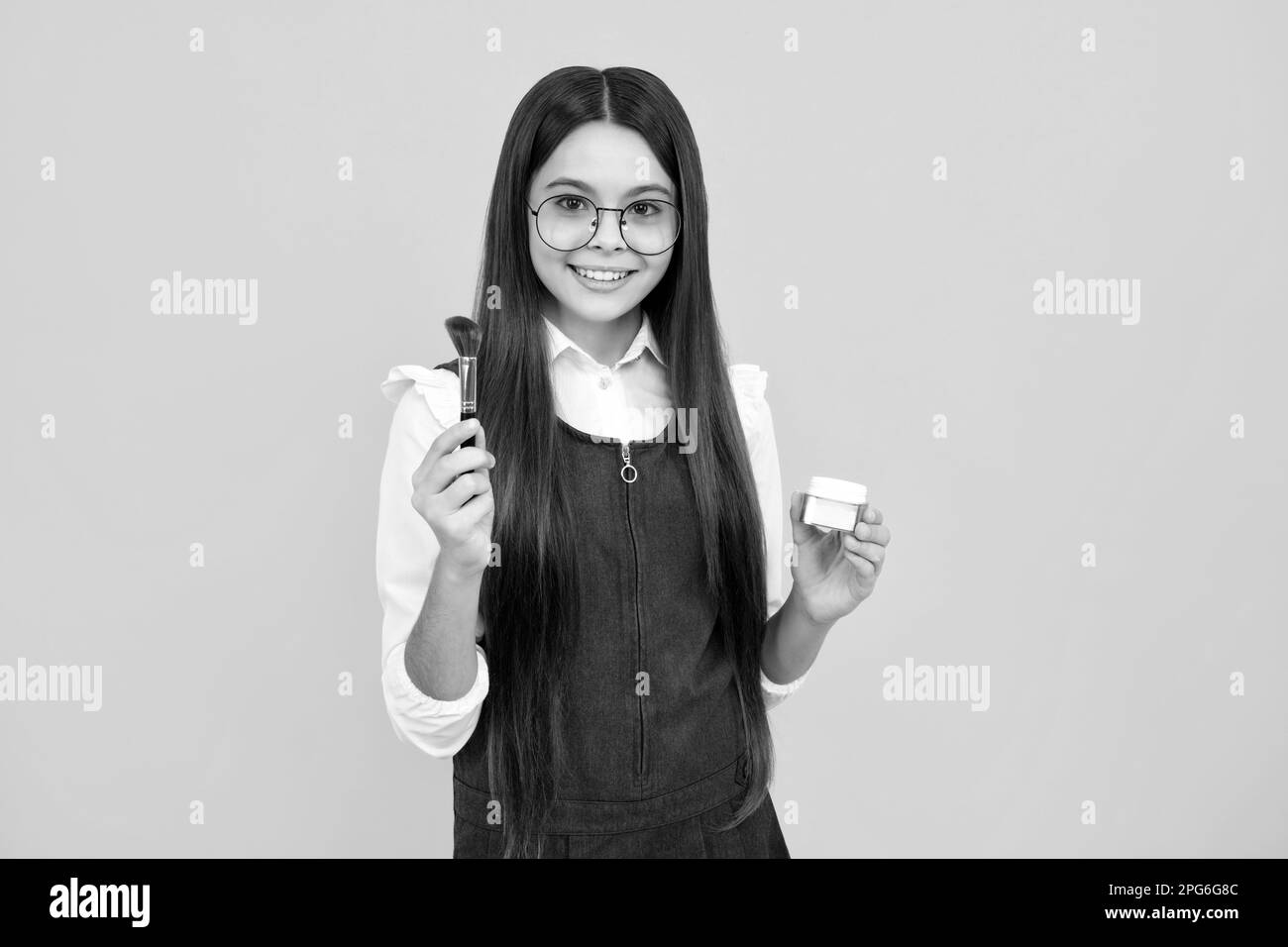 Kids make up products. Makeup teen child artist apply face powder with ...