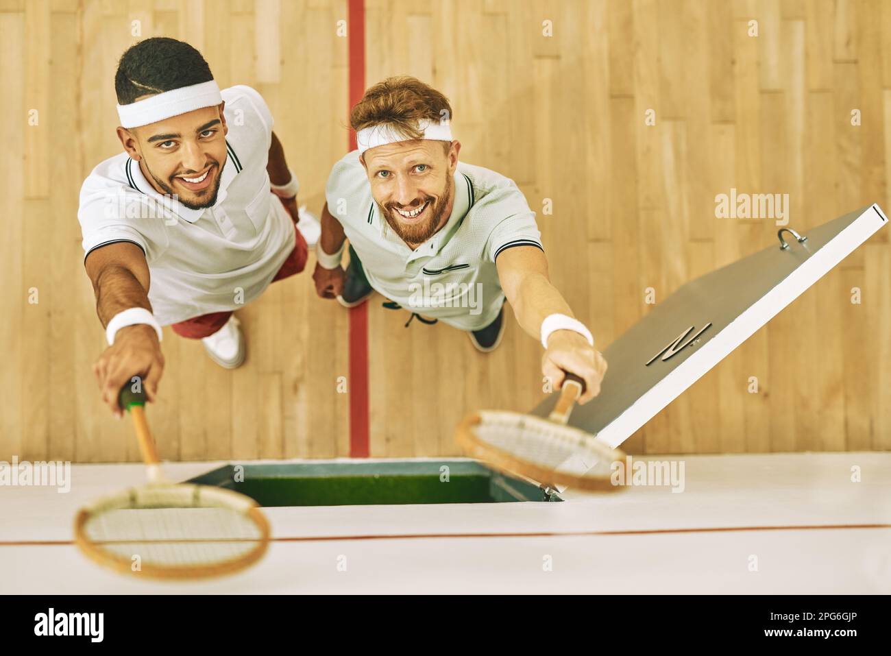 Once a squash player, always a squash player. High angle shot of two ...