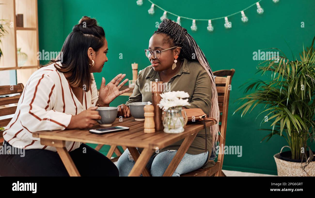 Make sure to make time for your friends. two young women chatting at a ...