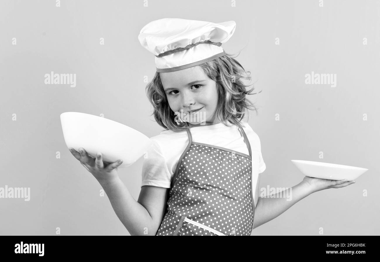 Funny kid chef cook with kitchen plate, studio portrait. Kid chef cook ...