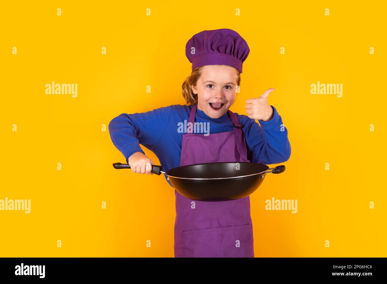 Kid boy chef cook with cooking pan. Kid in cooker uniform and chef hat ...