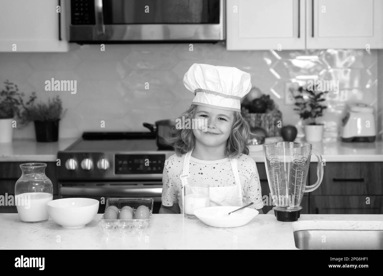 Funny little kid chef cook wearing uniform cook cap and apron cooked ...