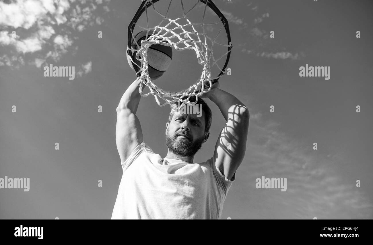 bearded man player throw basketball ball through basket, sport hobby ...