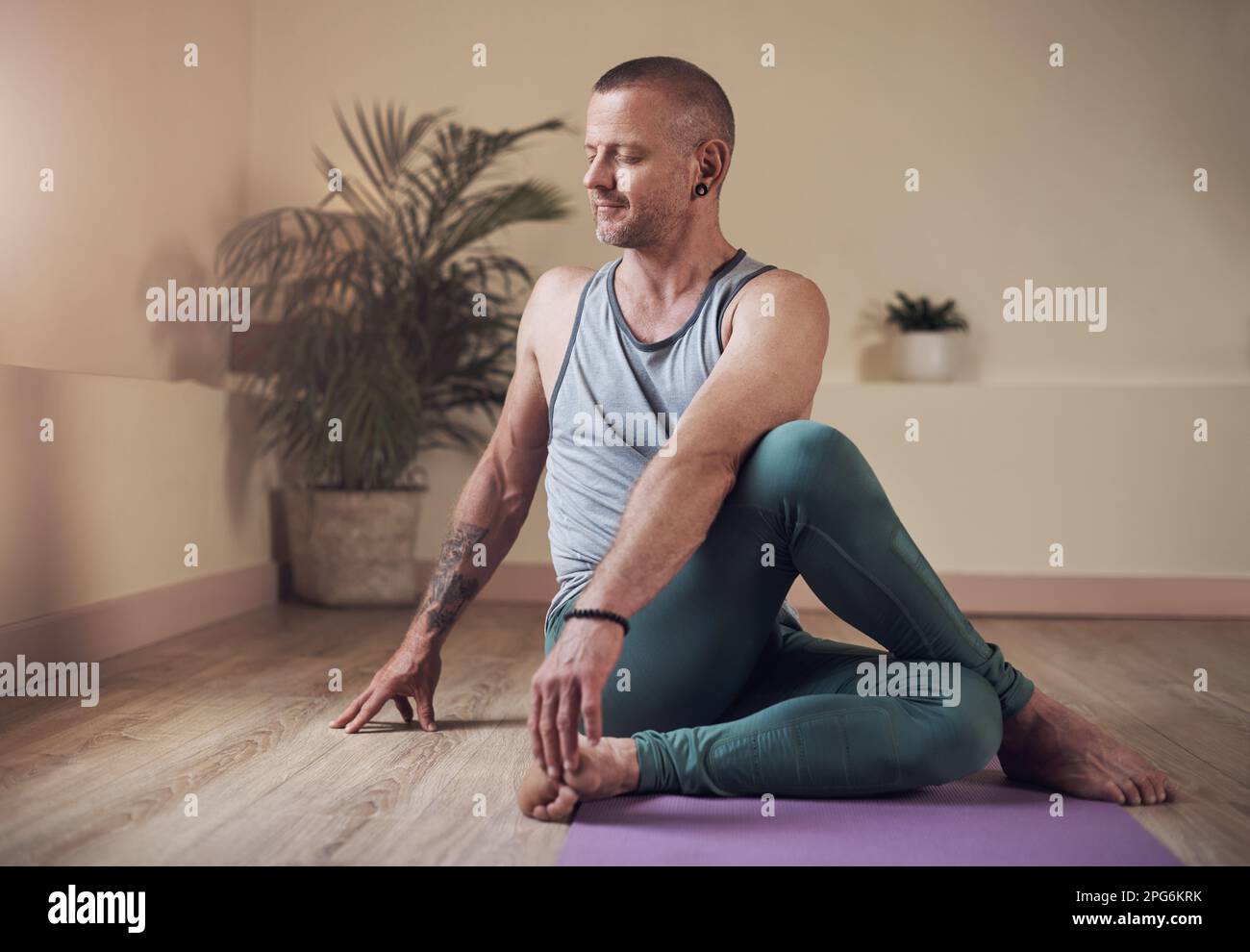 Stretching out the spine. Full length shot of a handsome young man ...