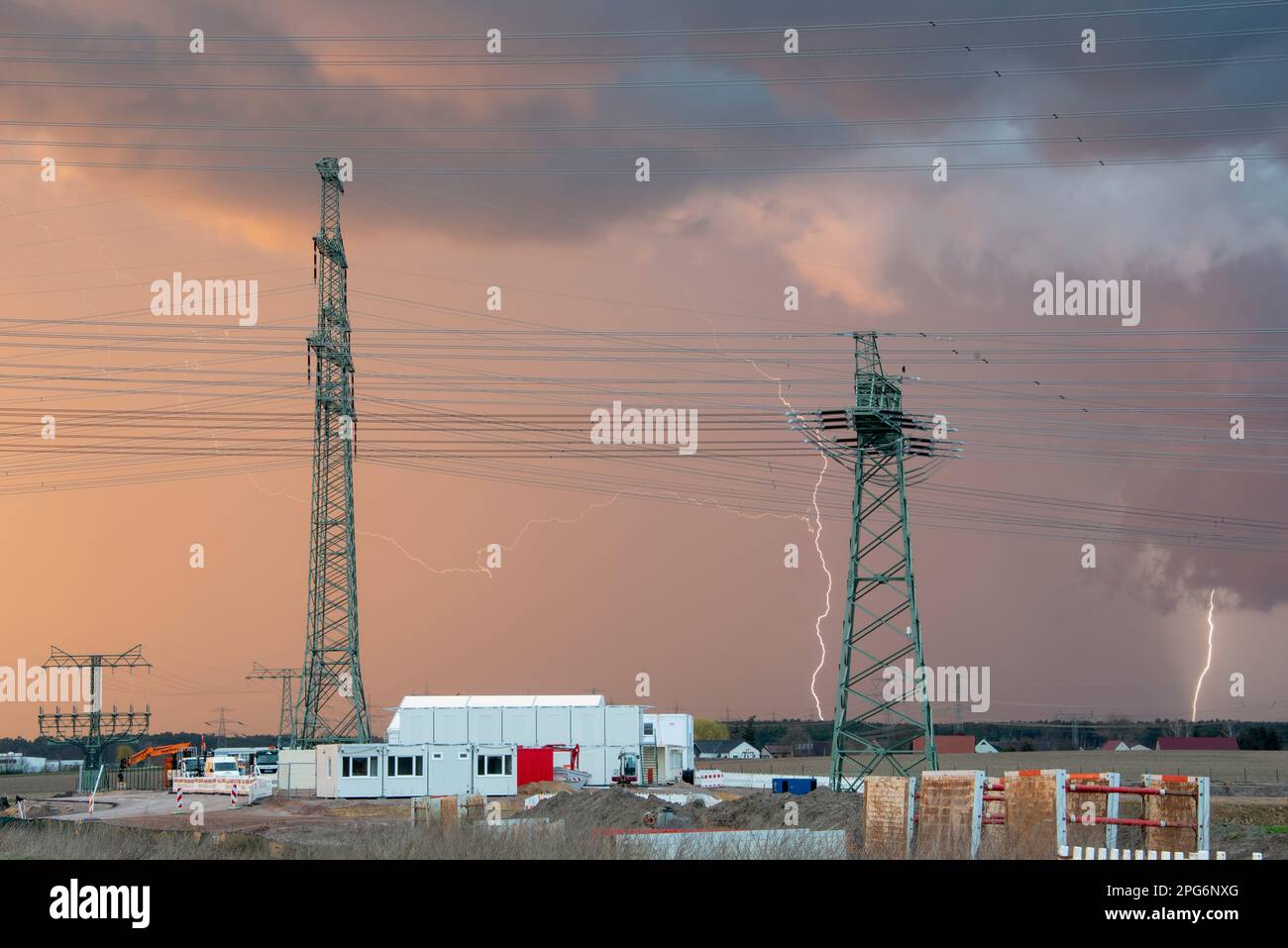 Thunderstorm cell, lightning over construction containers of the ...