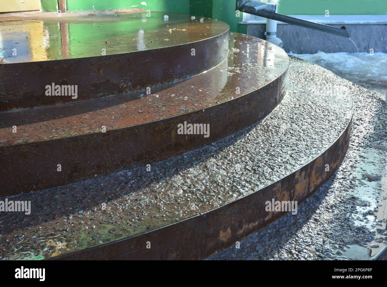 Slippery steps surface near the house entrance in the spring ice and ...