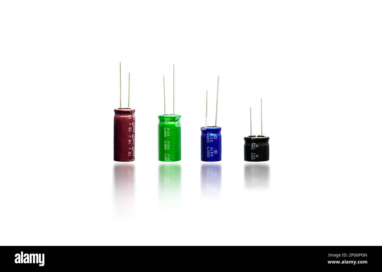 Electrolyte or electrolytic capacitor row isolated on white background with reflection ...