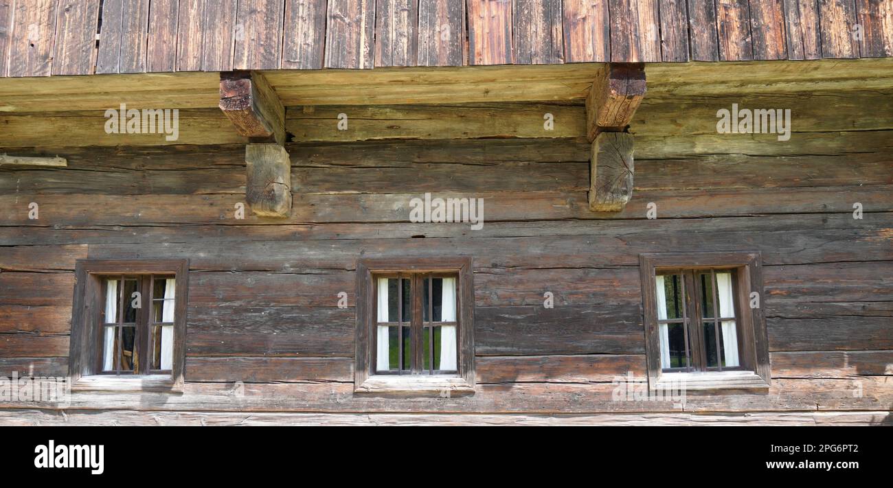 Aged wooden window with glazing and partially weathered in rustic homes ...