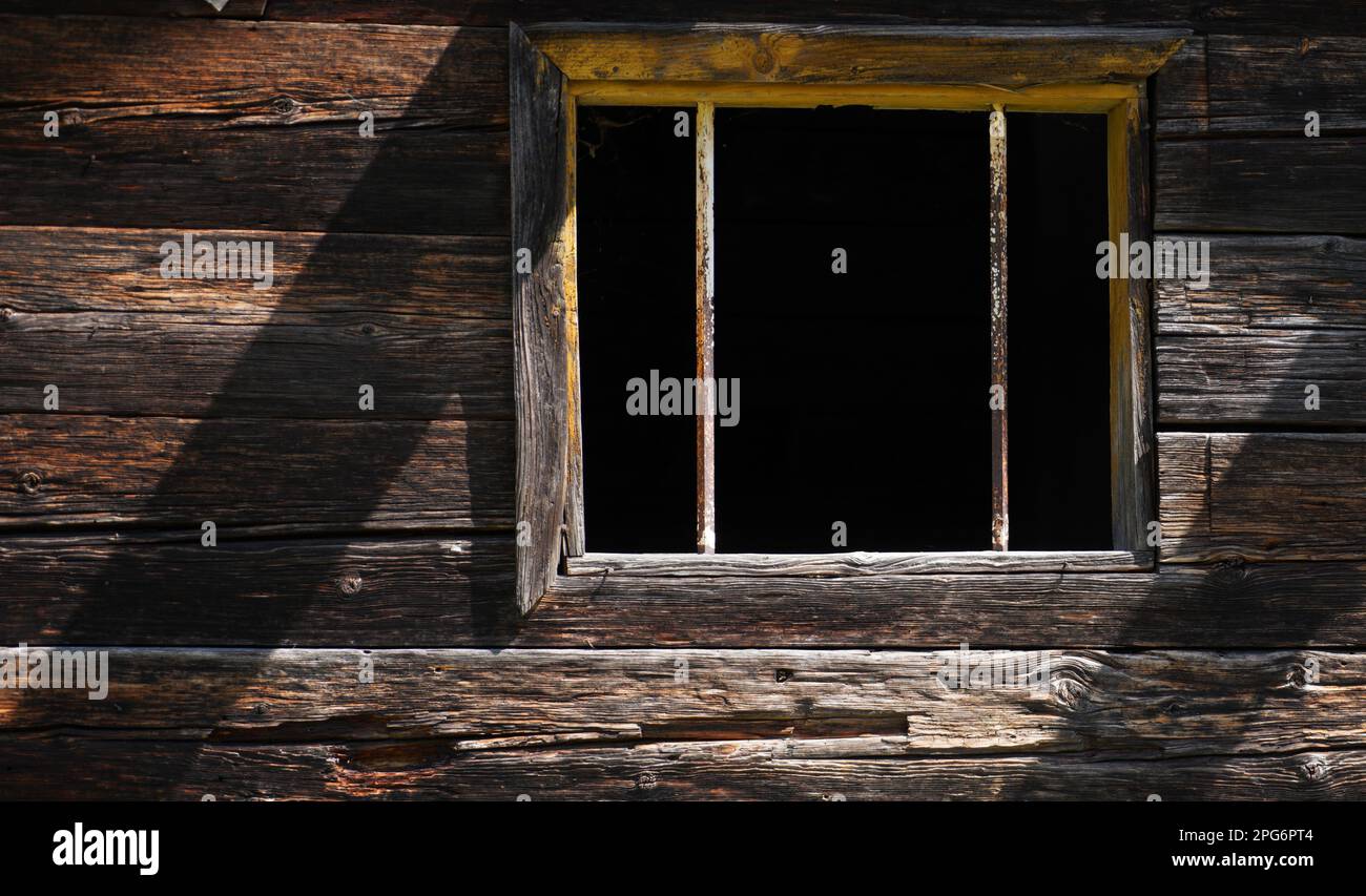 Aged wooden window with glazing and partially weathered in rustic homes ...