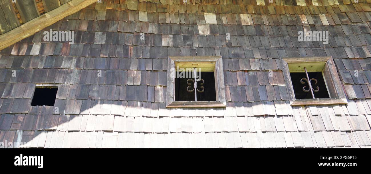 Aged wooden window with glazing and partially weathered in rustic homes ...