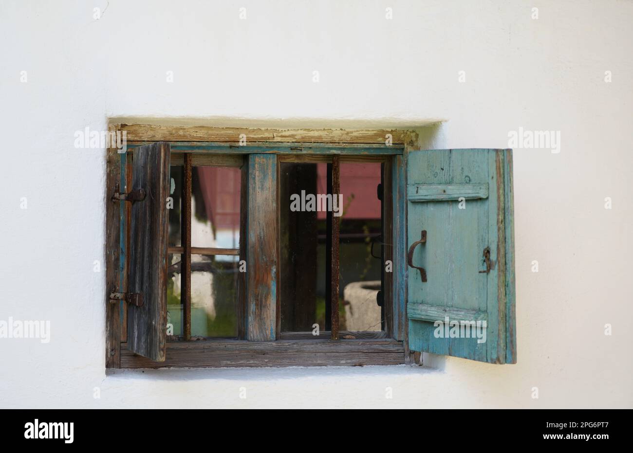 Aged wooden window with glazing and partially weathered in rustic homes ...