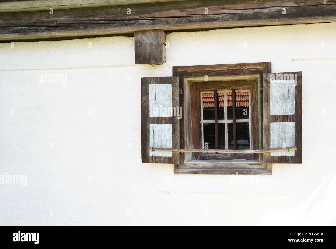 Aged wooden window with glazing and partially weathered in rustic homes ...