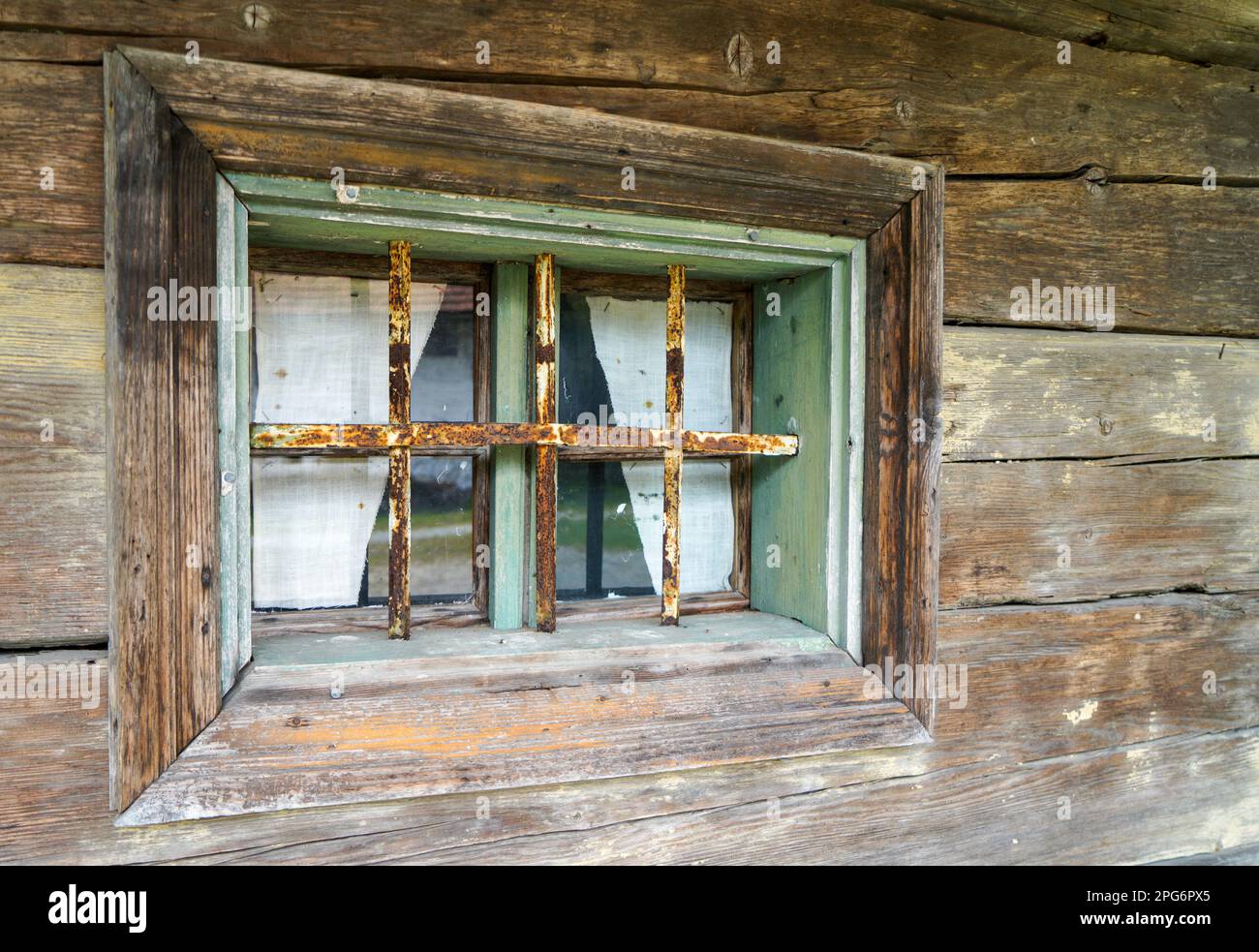 Aged wooden window with glazing and partially weathered in rustic homes ...